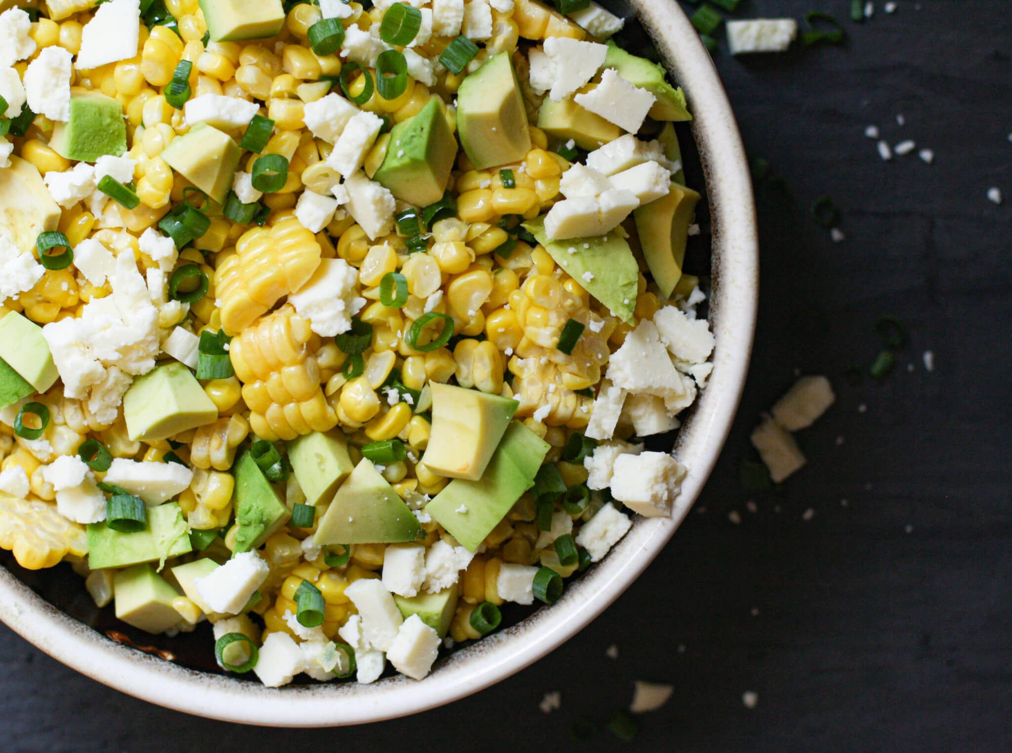 Sweet Summer Corn & Scallion Salad with avocado and cotija cheese